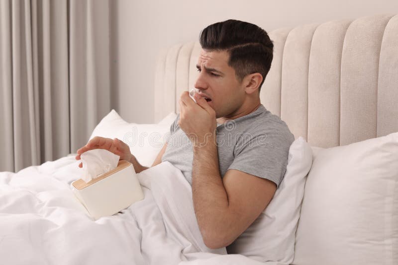Sick Man with Box of Paper Tissues Suffering from Cold in Bed at Home ...