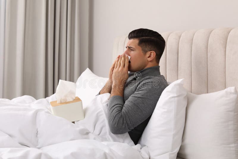Sick Man with Box of Paper Tissues Suffering from Cold in Bed at Home ...