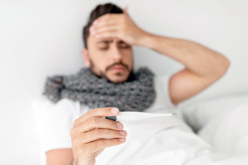 Sick Man Checking Body Temperature Holding Thermometer and Touching ...