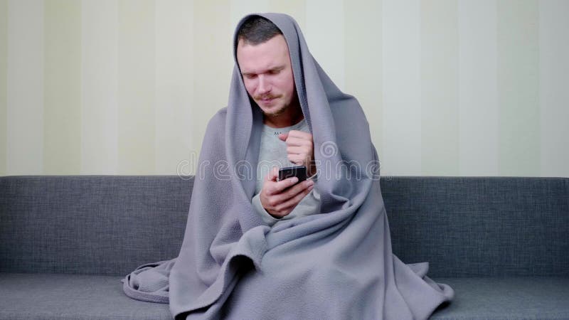 Sick And Angry Man Covered With Blanket And Looks Around Stock Video