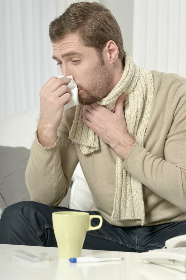 Sick man drinking warm tea stock photo. Image of nose - 78360706