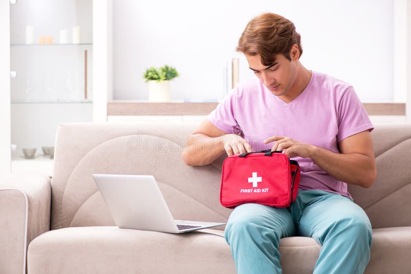 The Sick Man at Home with First Aid Kit Stock Photo - Image of case ...