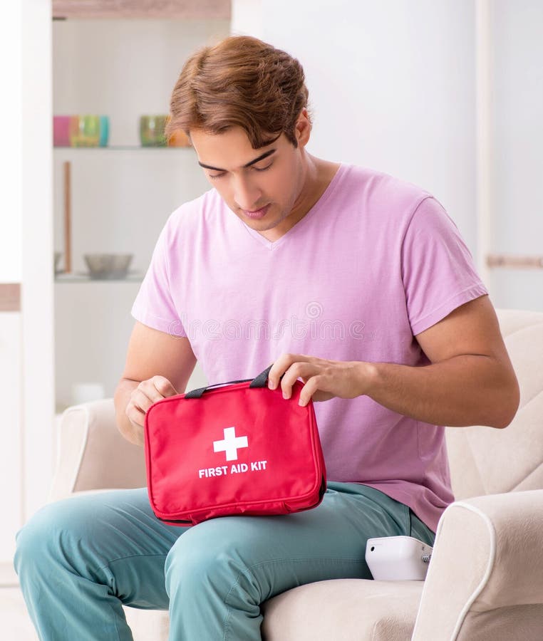 Sick Man at Home with First Aid Kit Stock Photo - Image of assistance ...