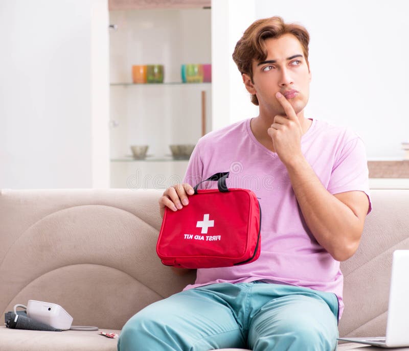 Sick Man at Home with First Aid Kit Stock Photo - Image of concerned ...