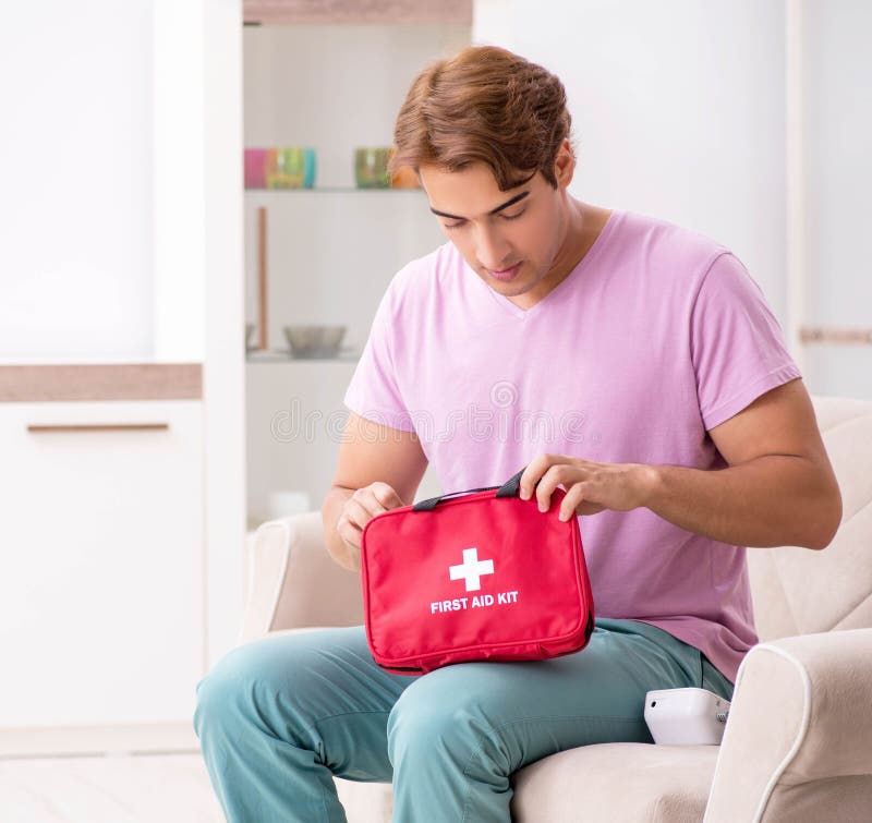 Sick Man at Home with First Aid Kit Stock Photo - Image of accident ...