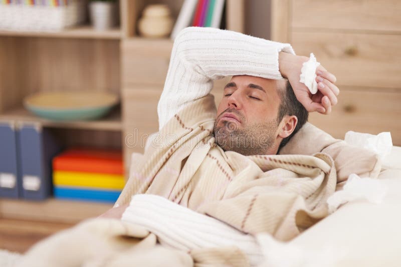 Sick Man Treating Fever stock image. Image of home, pillows - 34707103