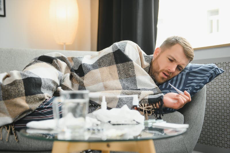 Sick Man Lying on Sofa at Home. Stock Image - Image of resting, people ...