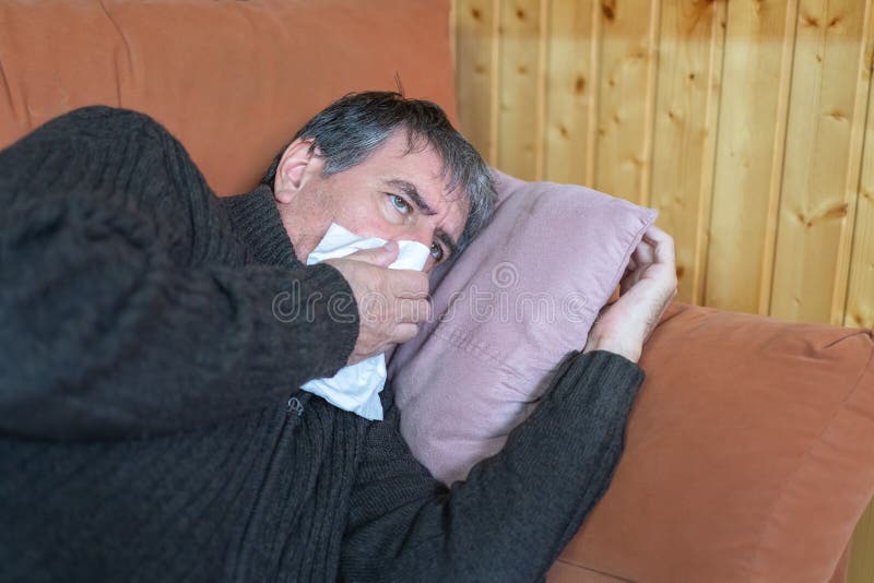 Sick Man with Cold and Nasal Congestion, Sucking a Spray Medication ...
