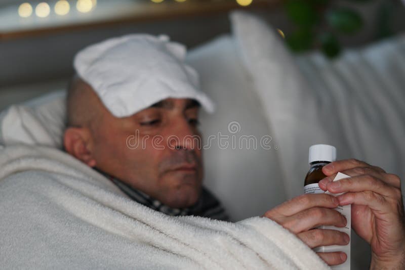 Sick Man Opening a Medical Syrup Bottle Stock Image - Image of male ...