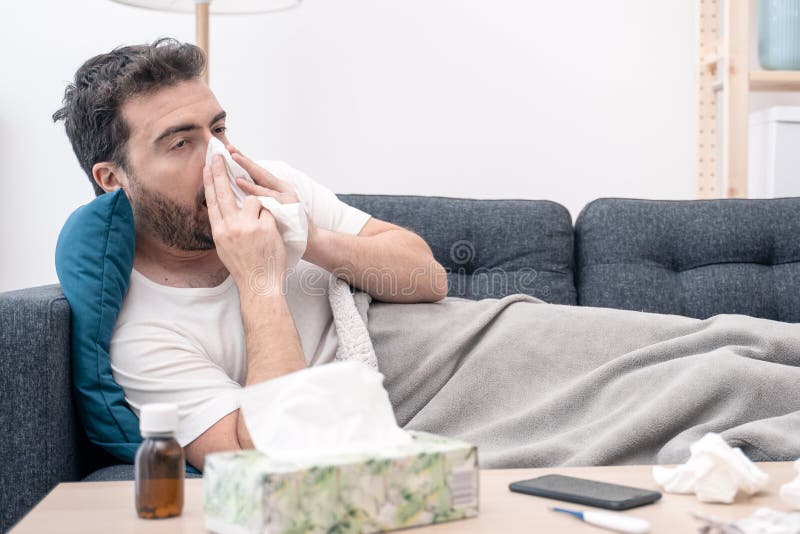 Sick Man Portrait on the Sofa Blowing Nose Stock Photo - Image of fever ...