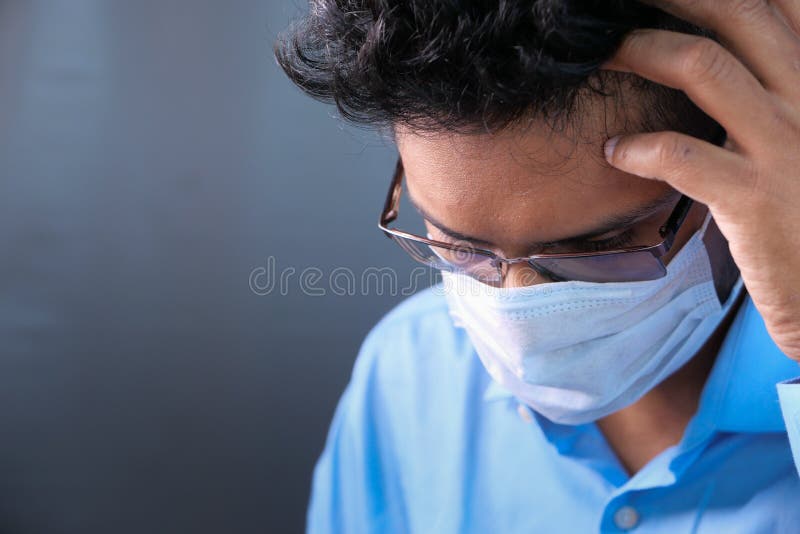 A Sick Man with Protective Mask in Face Looking Down Stock Image ...