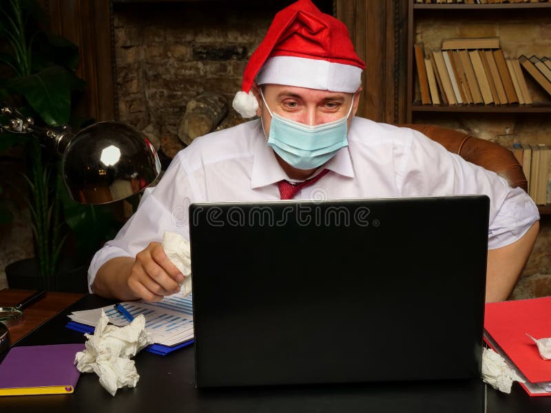 A Sick Man in Santa Hat Communicates on the Internet. New Year and ...