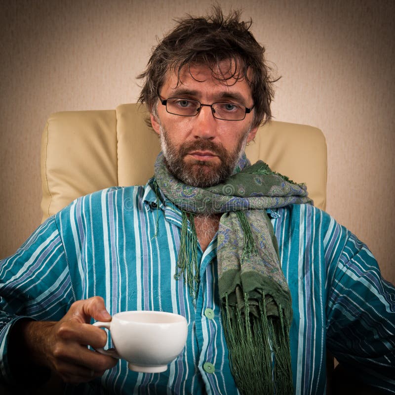 Sick Man Sitting in Chair with Cup Stock Photo - Image of home, pajamas ...