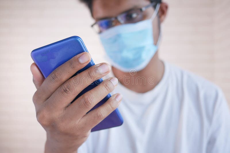 Sick Man in Surgical Face Mask Using Smart Phone, Selective Focus Stock ...