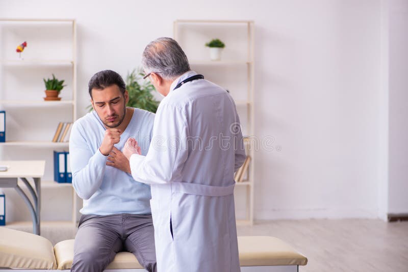 Young Sick Man Visiting Old Doctor Stock Image - Image of medical ...