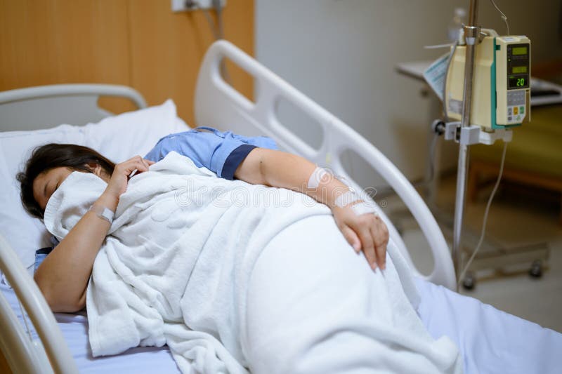 A Sick Patient Lies in a Hospital Bed Stock Photo - Image of alone ...