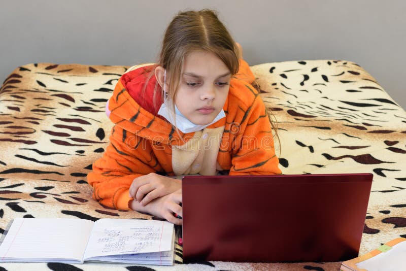 A Sick Quarantined Girl Learns Remotely Using a Laptop Stock Photo ...