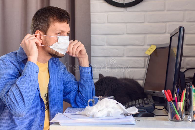 A Sick Quarantined Man Works At A Computer Stock Photo - Image of ...