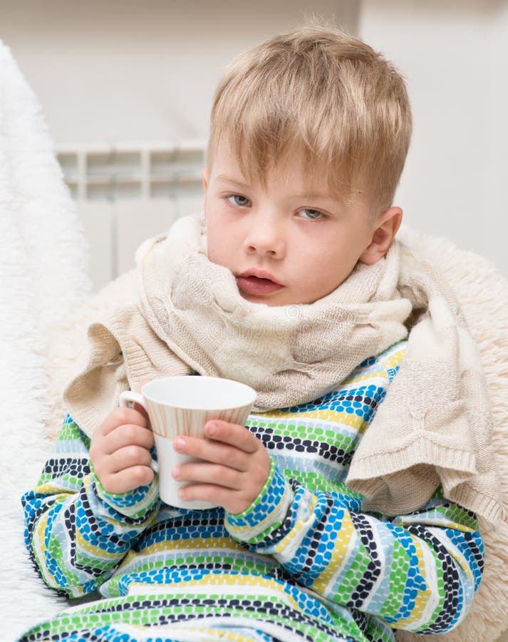 Sick Boy with a Cup in His Hand Sitting on the Bed Stock Image - Image ...