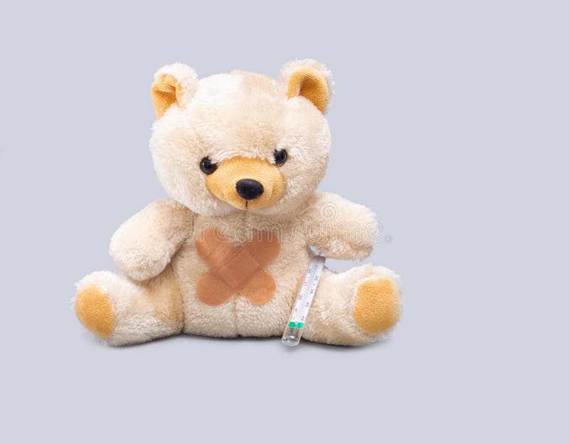 Teddy bear with band-aid stock image. Image of exam - 215442317