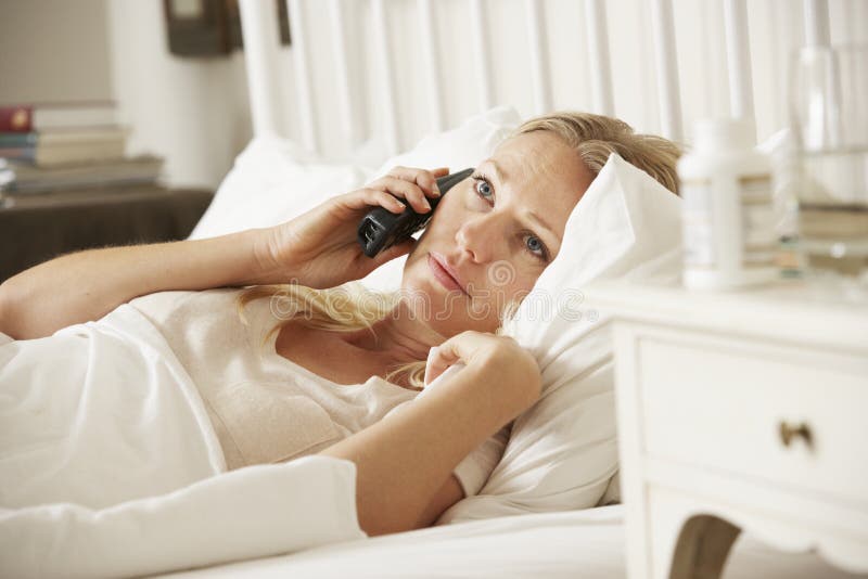 Sick Woman in Bed at Home Talking on Phone Stock Photo - Image of ...