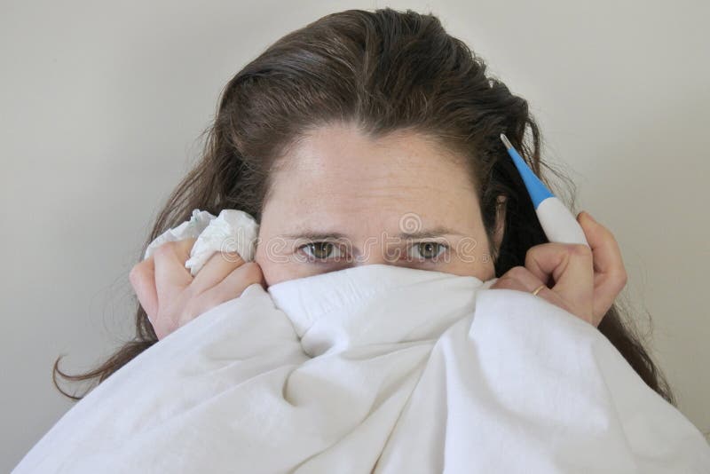 Sick Woman with a Cold in Bed Looking at the Camera Stock Image - Image ...