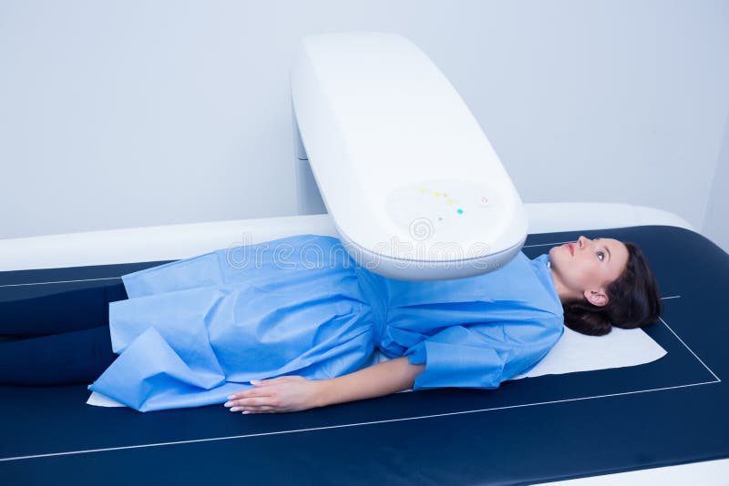 Sick Woman Lying on a X-ray Machine Stock Photo - Image of technology ...