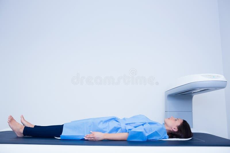 Sick Woman Lying on a X-ray Machine Stock Photo - Image of equipment ...