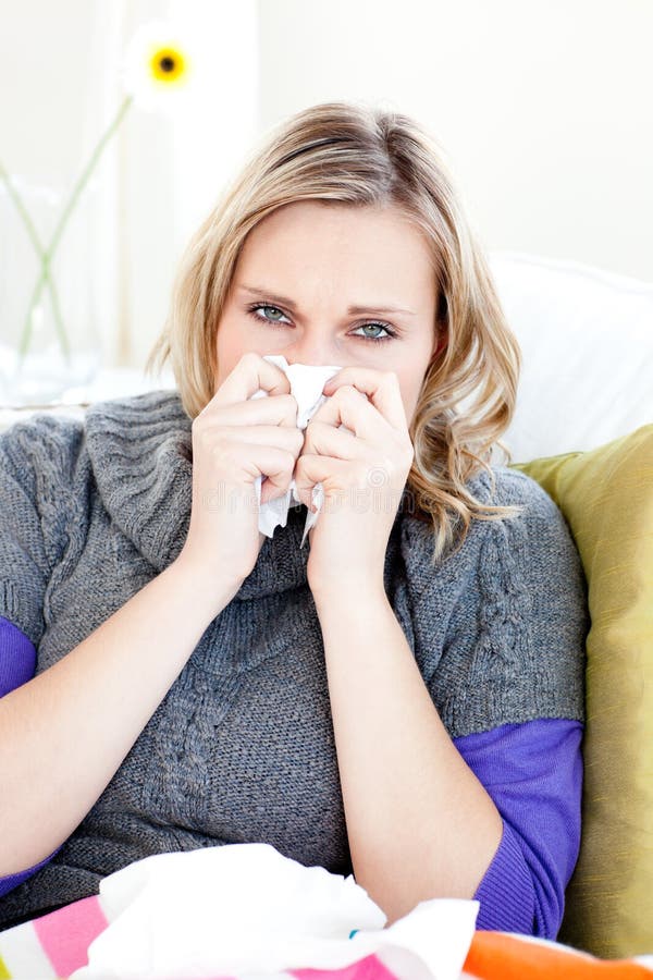 Sick Woman Using a Tissue Sitting on a Sofa Stock Image - Image of ...