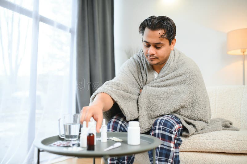 Sick Young Hindu Man Feeling Bad in the Morning, Sitting on Bed Stock ...