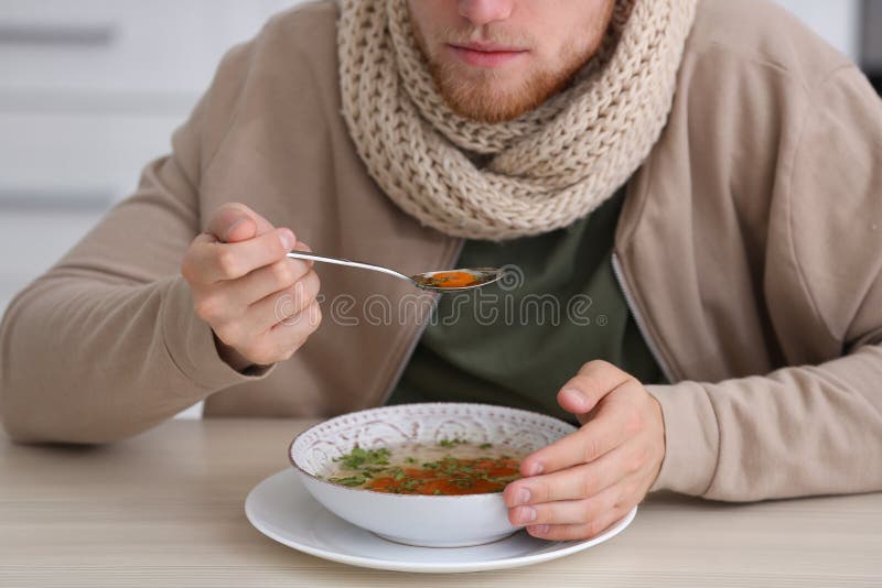 Sick Young Man Eating Soup To Cure Flu at Table Stock Image - Image of ...