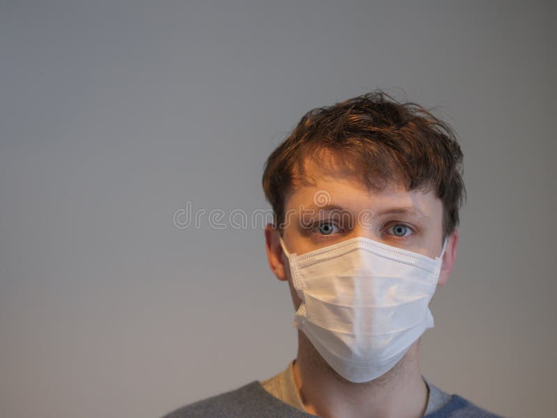 A Sick Young Man Wearing a Mask To Prevent the Spread of Virus Stock ...