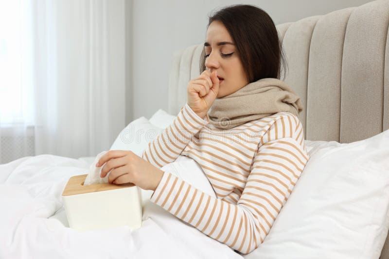 Sick Young Woman with Box of Tissues in Bed at Home Stock Image - Image ...