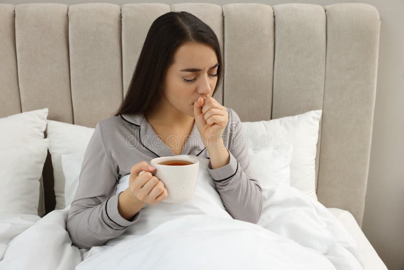 Sick Young Woman with Cup of Hot Tea in Bed Stock Photo - Image of cold ...