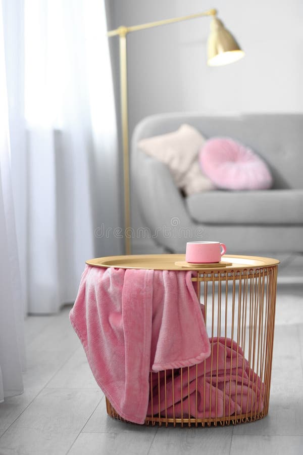 Side Basket Table with Cup of Coffee and Blanket in Room Interior Stock ...