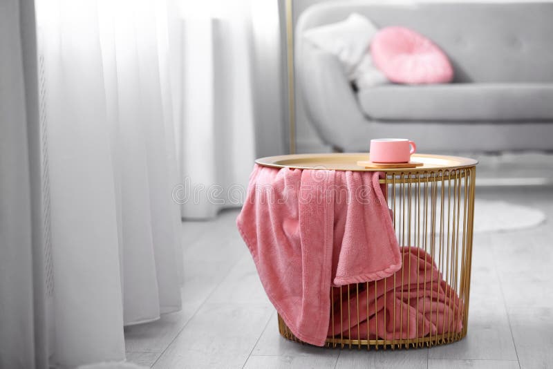 Side Basket Table with Cup of Coffee and Blanket in Room Interior Stock ...