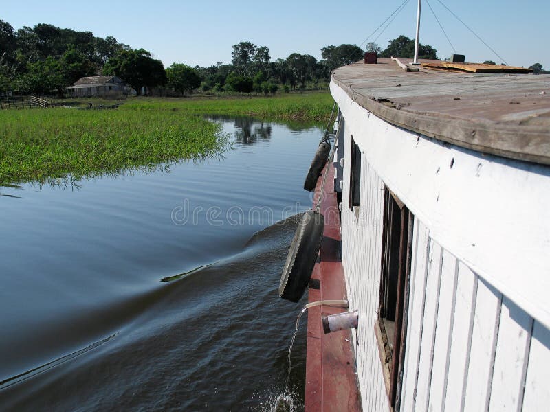 Boat in Amazon river stock photo. Image of feet, clouds - 17385644