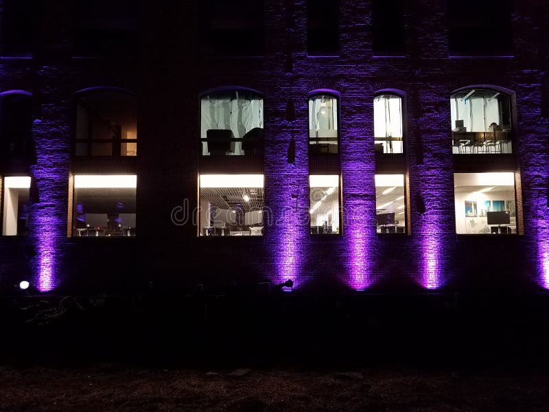 Side of Brick Building with Purple Lights Stock Photo - Image of dark ...