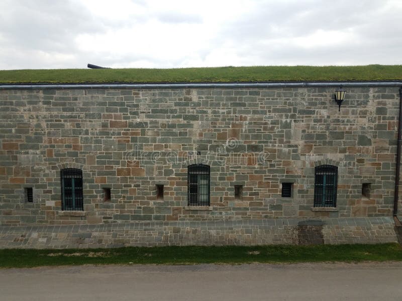 Side of a Castle Wall with Stones and Windows and Grass Stock Image ...