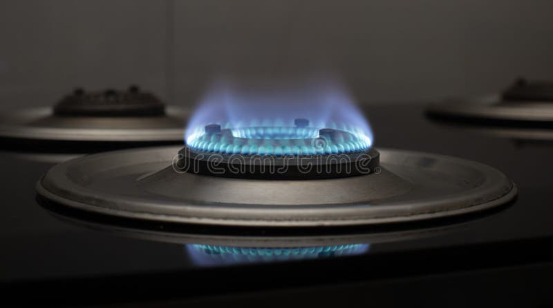Side Close Up View of a Domestic Stove Burner Lit Up Stock Image ...