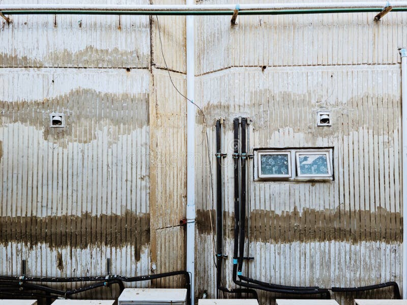 Side of Concrete Building, There are Windows and Pipes. Stock Image ...