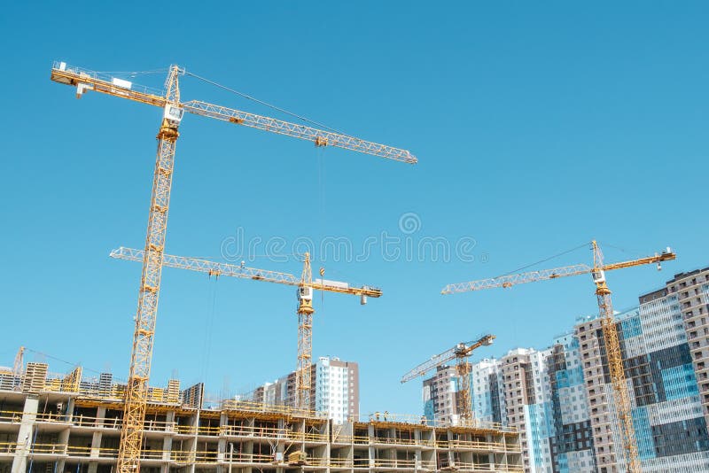 Side with Cranes Against Blue Sky Stock Photo - Image of commercial ...