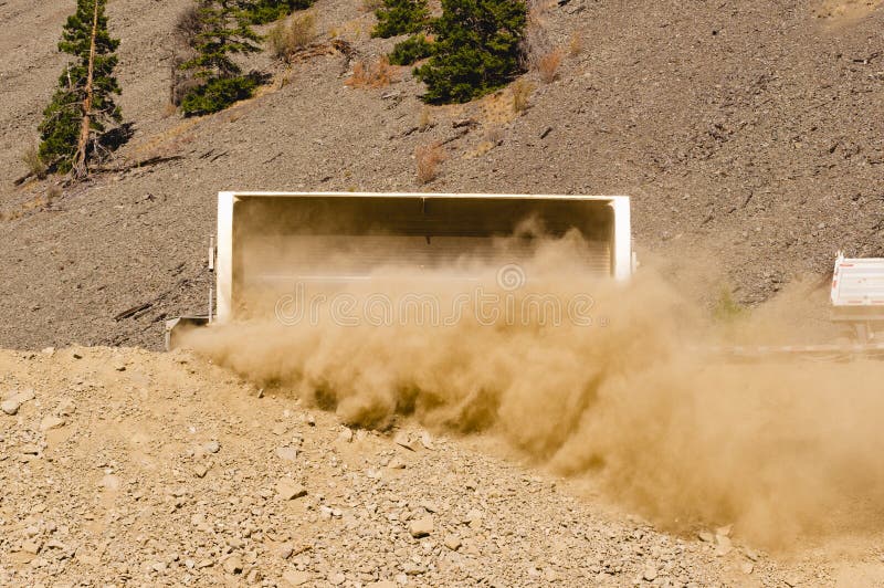 A Side Dumping Trailer Dumping Its Dusty Load Stock Image - Image of ...