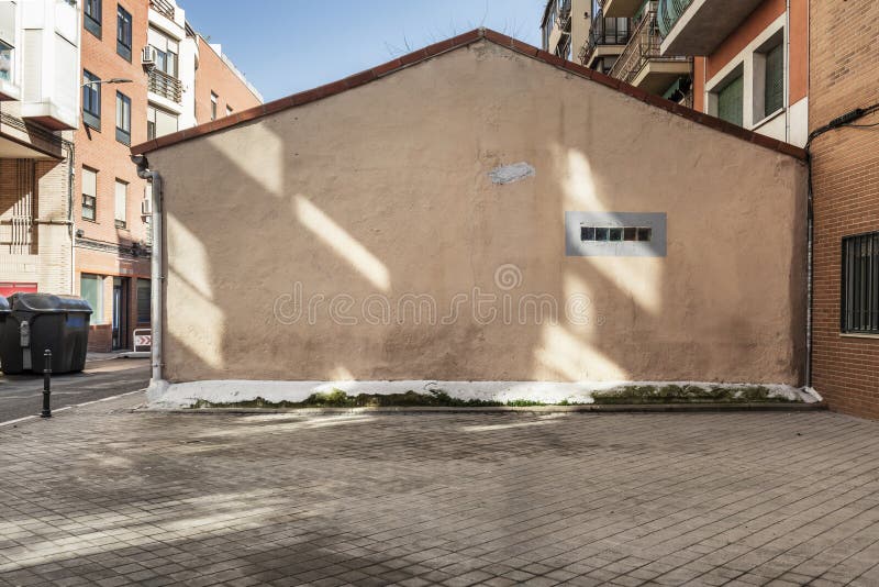 Side Facade of a Small House Built in the Middle of the Street Stock ...