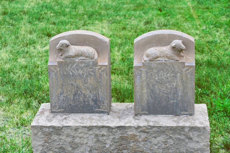 Side by Side Grave Markers with Lamb Carvings Stock Photo - Image of ...