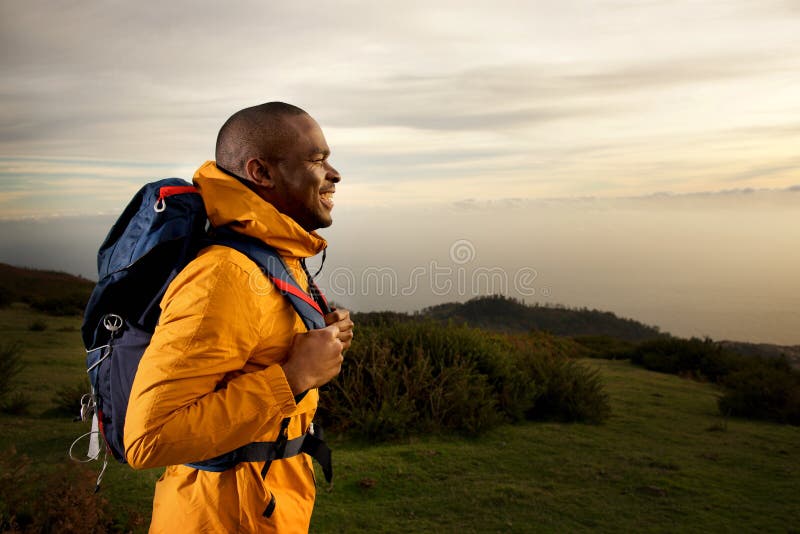 Side of Happy Male Backpacker Walking Outdoors in Nature Stock Image ...