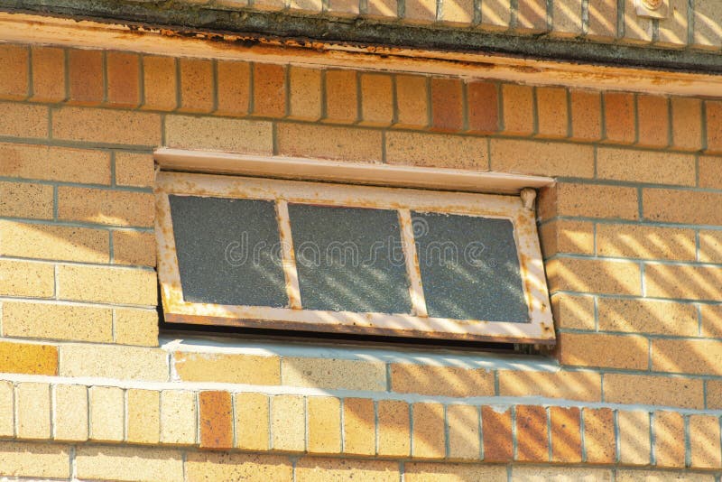 Side House Window To Basement Access Slightly Open or Ajar in Shade on ...