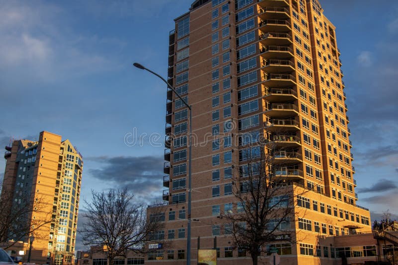 Side Lit Tall Red Brick High Rise Building Stock Photo - Image of rooms ...