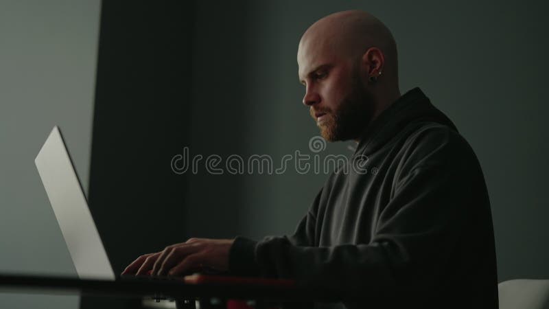 Side Low-angle View of Young Bald Programmer with Ginger Beard and Ear ...
