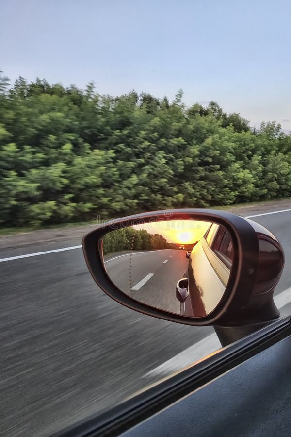 In the Side Mirror of the Car, the Sunset Stock Photo - Image of ...